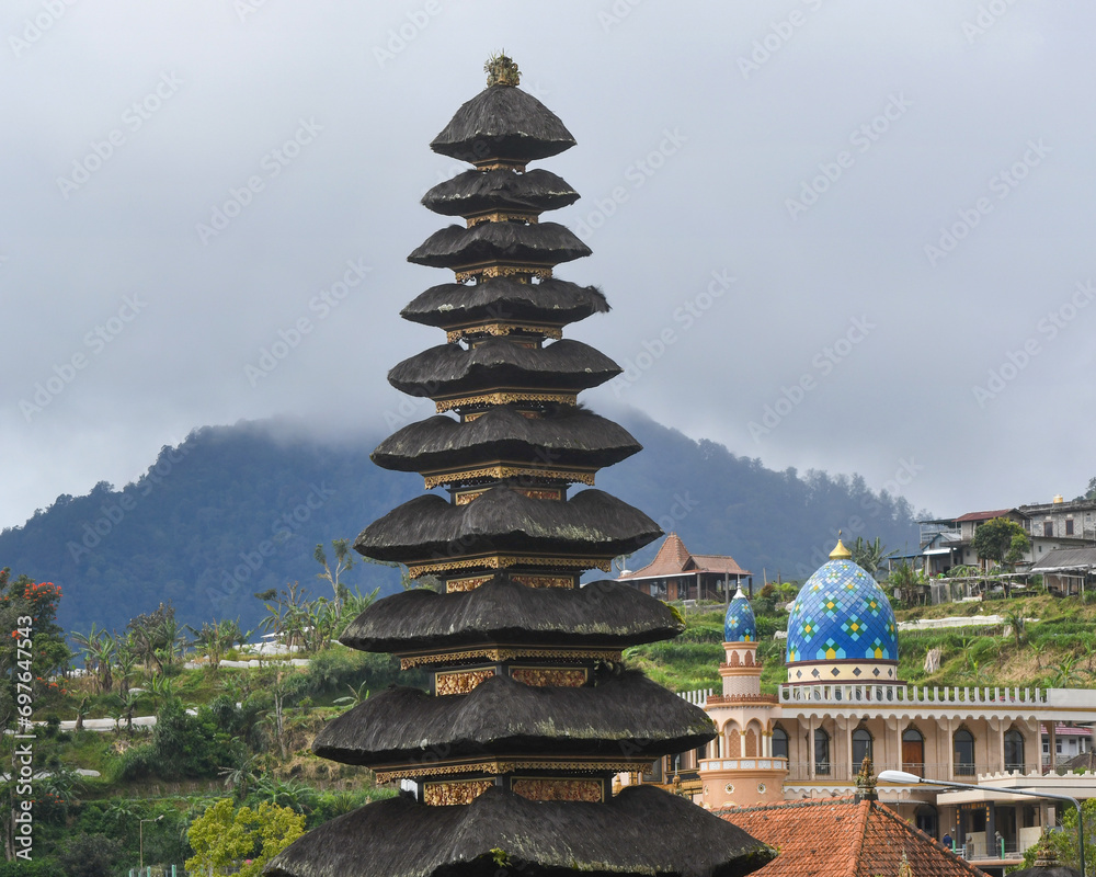 Meru tower of Ulun Danu Beratan temple and Masjid Besar Al Hidayah ...