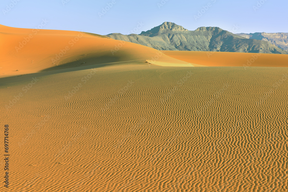 SAND DUNES AND ROCK FORMATIONS IN THE REGION OF TADRART ROUGE IN THE ...