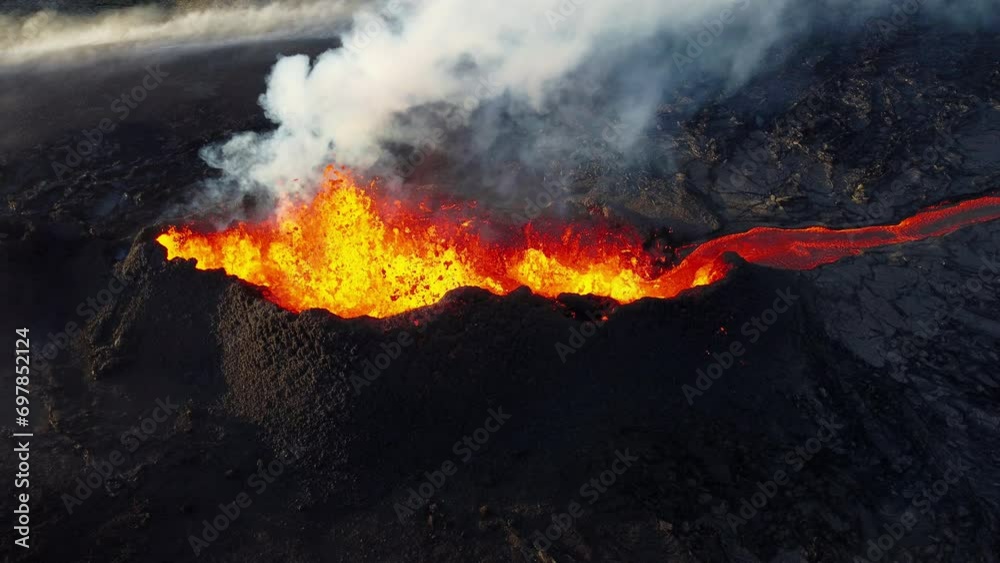 Vidéo Stock Volcano eruption, red hot burning lava erupts from ground ...
