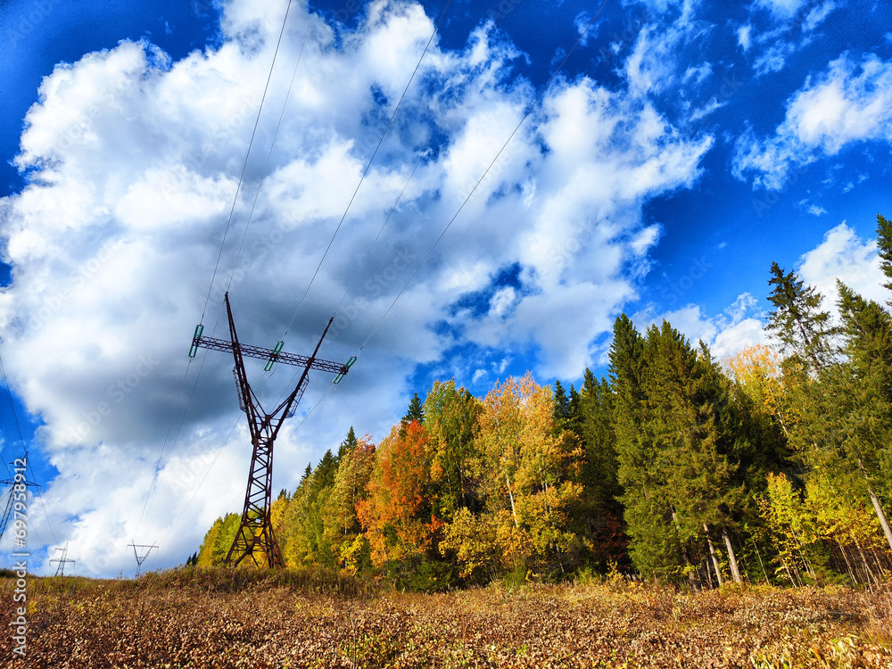 Power lines on a hill, hill or in the mountains against a blue sky with ...