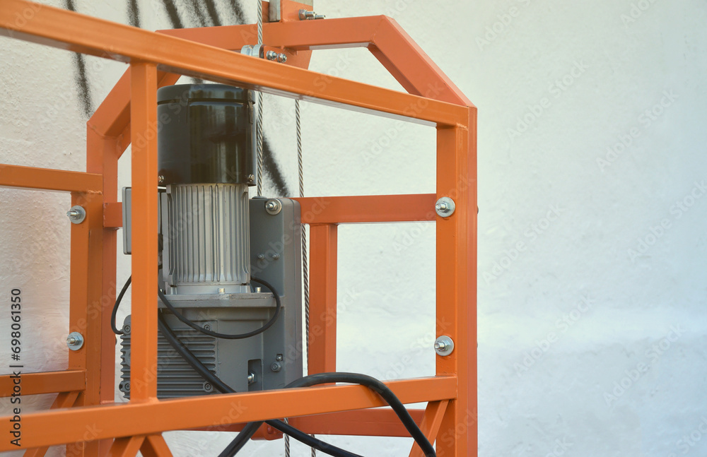 Hoist supply and safety lock as part of suspended wire rope platform ...