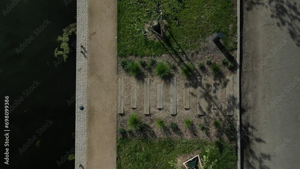 Pier for park visitors. two steps lead to it. planks terrace over water ...