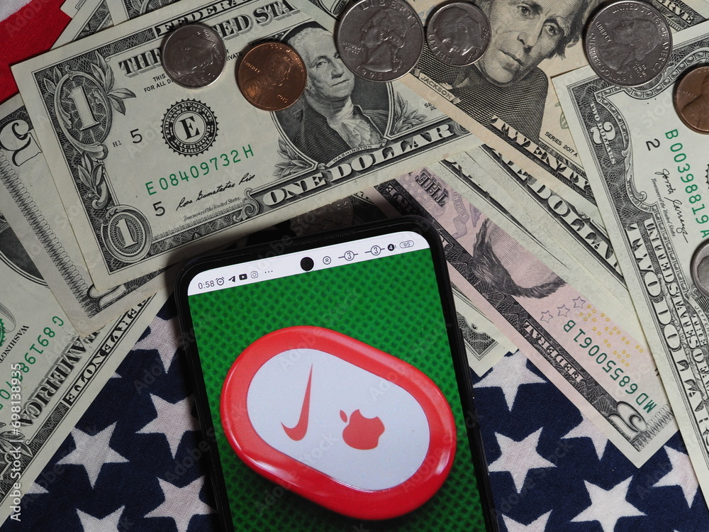 In this photo illustration, a Nike+iPod logo seen displayed on a ...