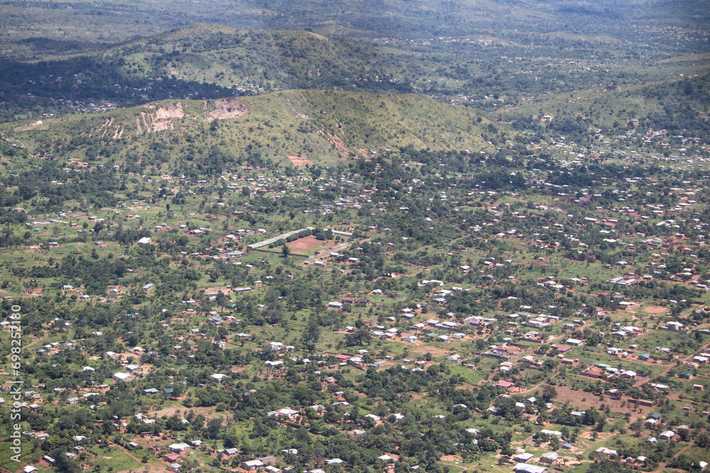 View from helicopter overflies African villages made of mud in ...