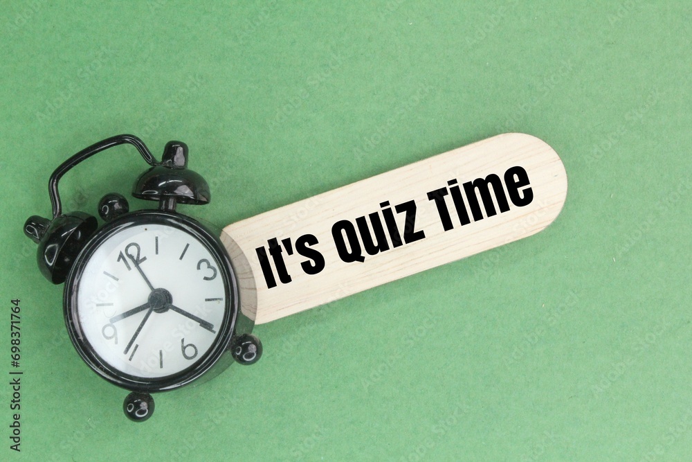 bell and stick clock with the words Its Quiz Time. the concept of ...