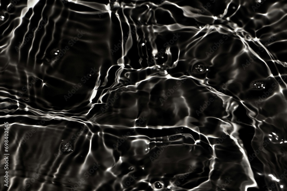 Black water waves on the surface ripples blurred. Defocus blurred ...