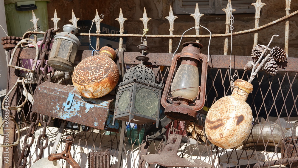 Collection of old utensils. Rust and peeling paint. Lanterns and flags ...