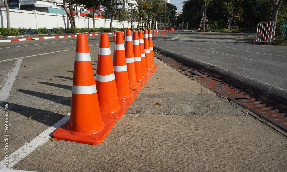 Road traffic cone, white-marked parking lot, and road traffic cones use ...