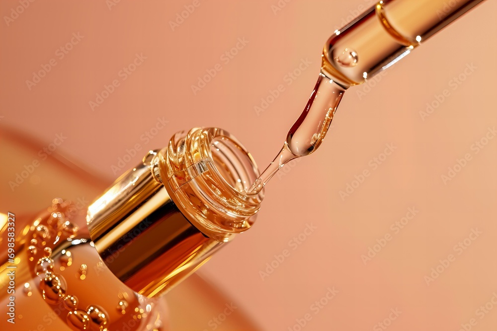 macro shot long pipette dropper with pouring golden serum flat lay ...