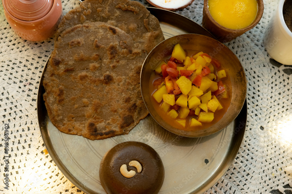 Rajgira Puri, Aloo Sabji, Boondi Raita and Singhare Halwa and Aamras ...