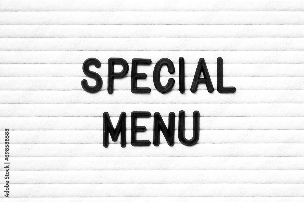 Black color letter in word special menu on white felt board background ...