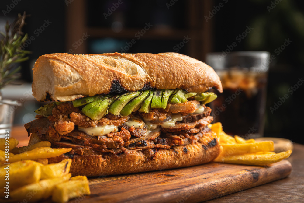 Traditional Peruvian sandwich of roast beef in its juice with avocado ...