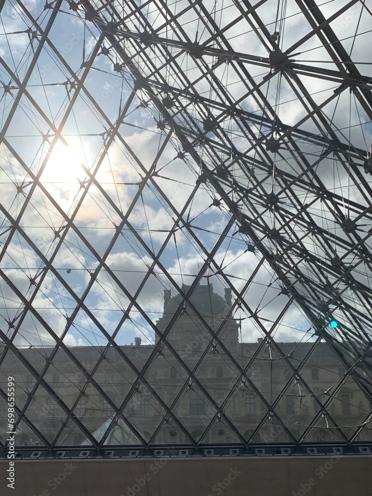View across the Pyramid of the Louvre Museum, exterior busy day people ...