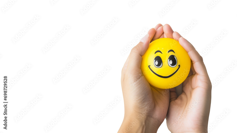 Hand holding a smiley face stress ball against a transparent background ...