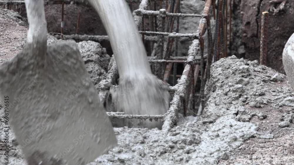 Cement mixing machine making cement into the iron beam structure of a ...
