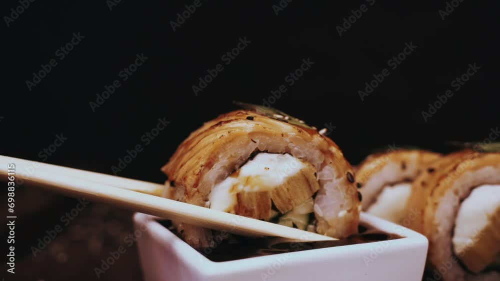 4k footage Fresh Sushi roll Falling into Soy Sauce. Zoom in slide video ...