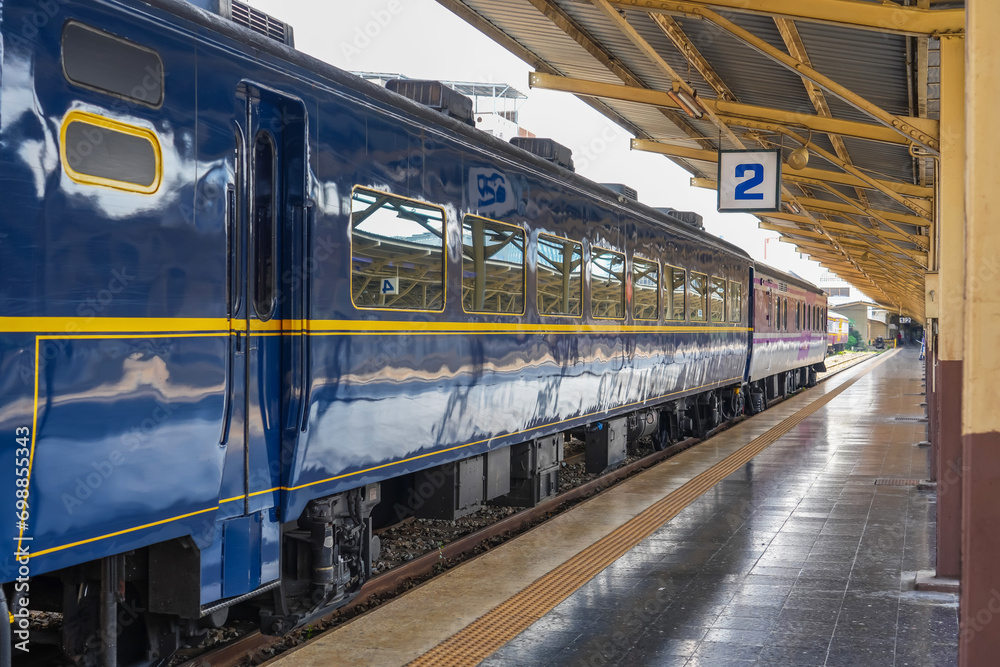 Passenger cars of the train on the platform of the railway station ...
