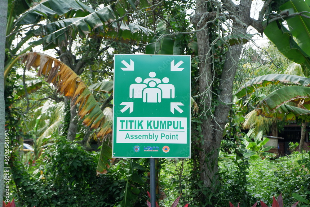 KDM, BPBD and Bontang company logos. green warning board Assembly Point ...