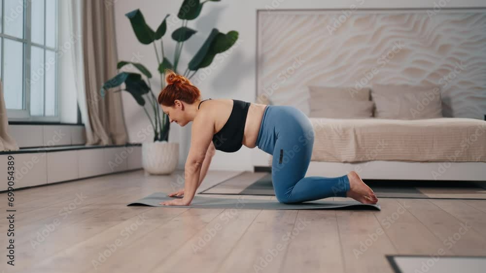 Woman training exercising at home on mat. Overweight female doing ...