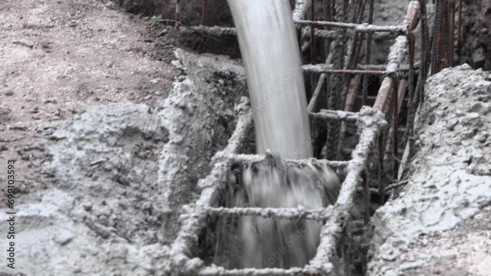 Cement mixing machine making cement into the iron beam structure of a ...