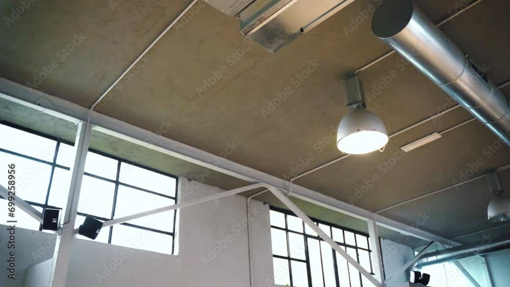 Metal pipes installed on ceiling for air circulation in big spaces ...