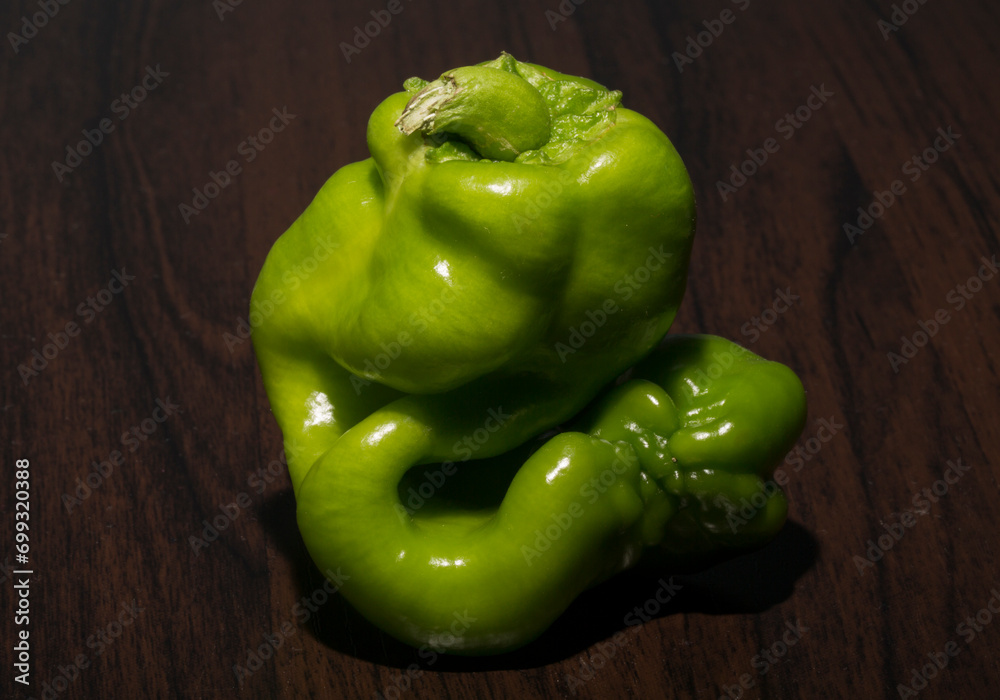 Green bell pepper (also known as sweet pepper, or capsicum) is the ...