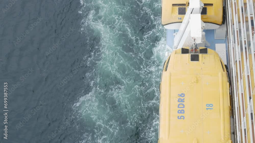 Vidéo Stock Lifeboat on giant cruise ship view down to ocean surface ...