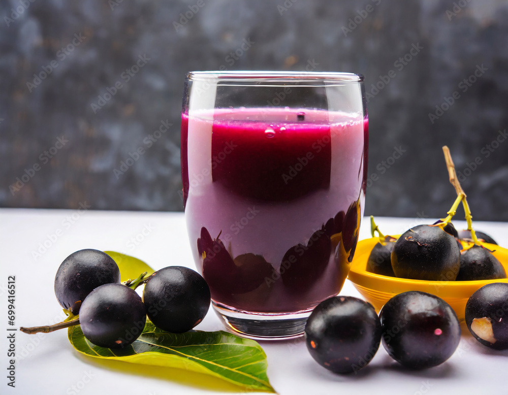 Juice of jamun fruit in a glass also called as java plum, jambolan plum ...