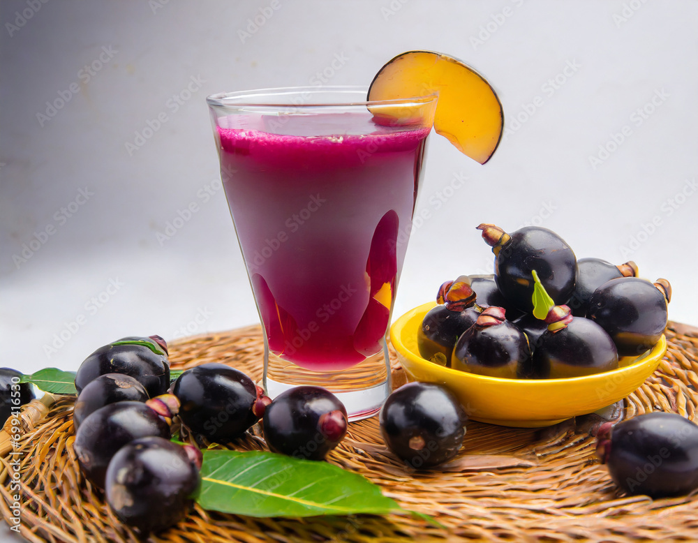 Juice of jamun fruit in a glass also called as java plum, jambolan plum ...