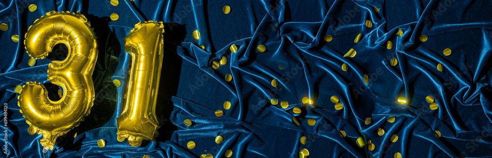 number thirty one, gold foil balloon number on blue velvet background ...