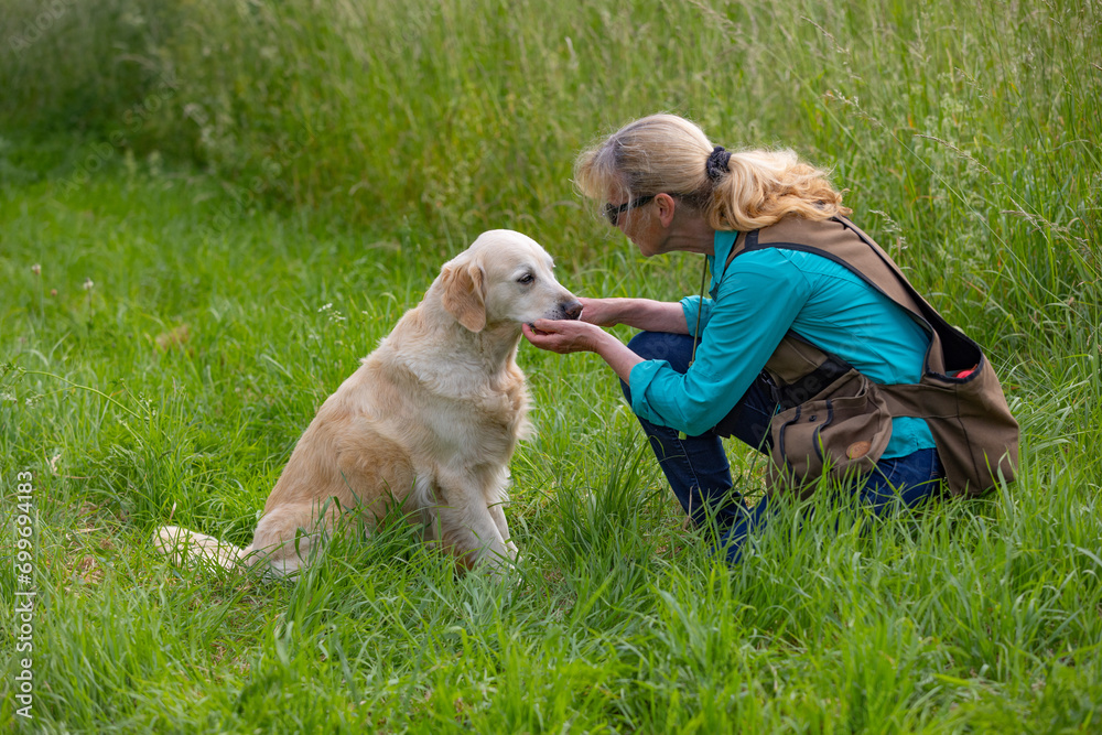 Female Dog owner with her Golden retriever Stock Photo | Adobe Stock