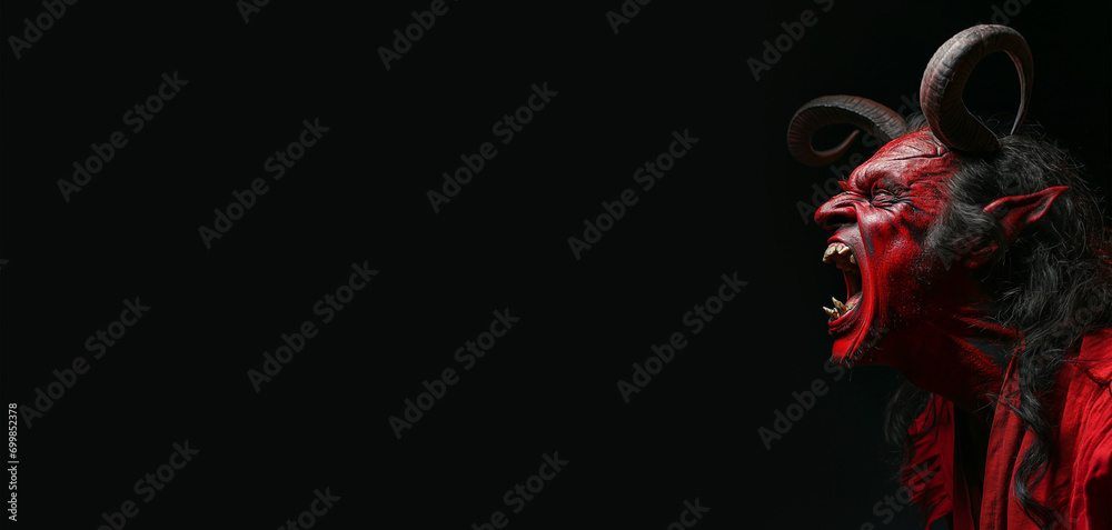 Angry devil profile with copy space for text - black background ...