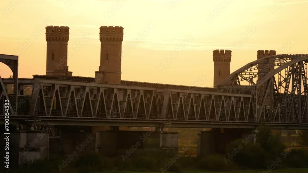 Historic railway bridge with towers. Train carries cargo by rail ...