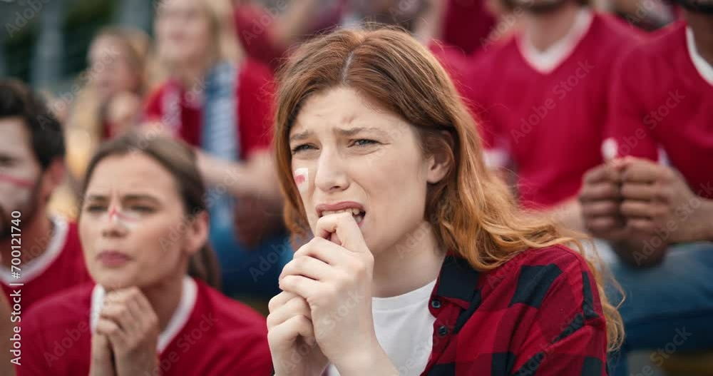 Pretty Caucasian girl worrying while watching football match. Woman ...