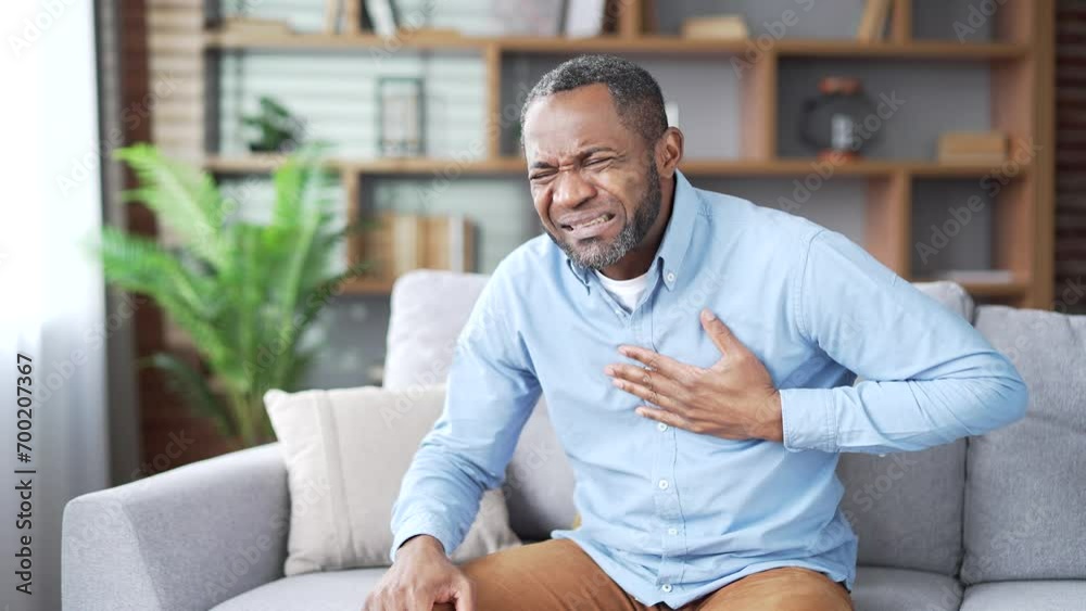 Sick mature african american man suffering from chest tension, heart ...