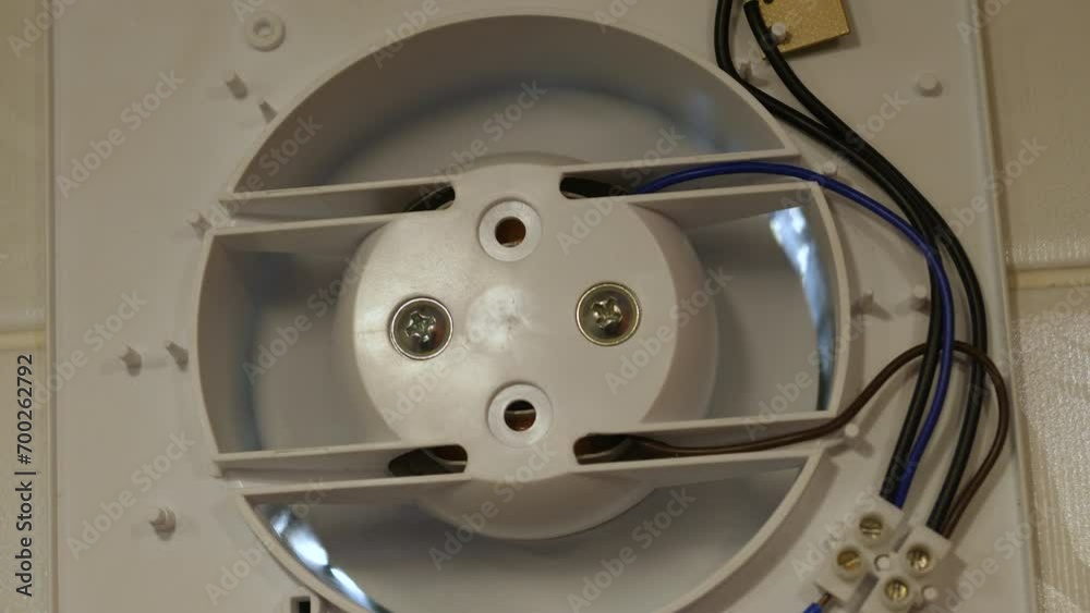 close-up installation and testing of the exhaust fan. installing an ...