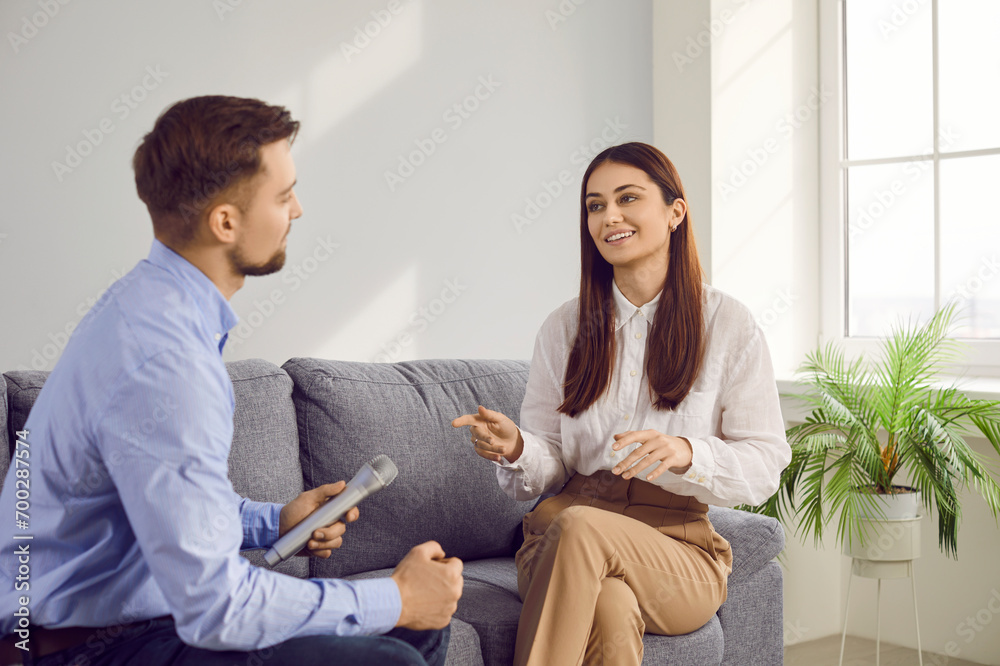 Successful actress giving interview on talk show. Happy beautiful young ...