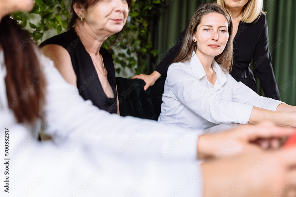 Successful businesswoman participates attentively listens. Mature ...