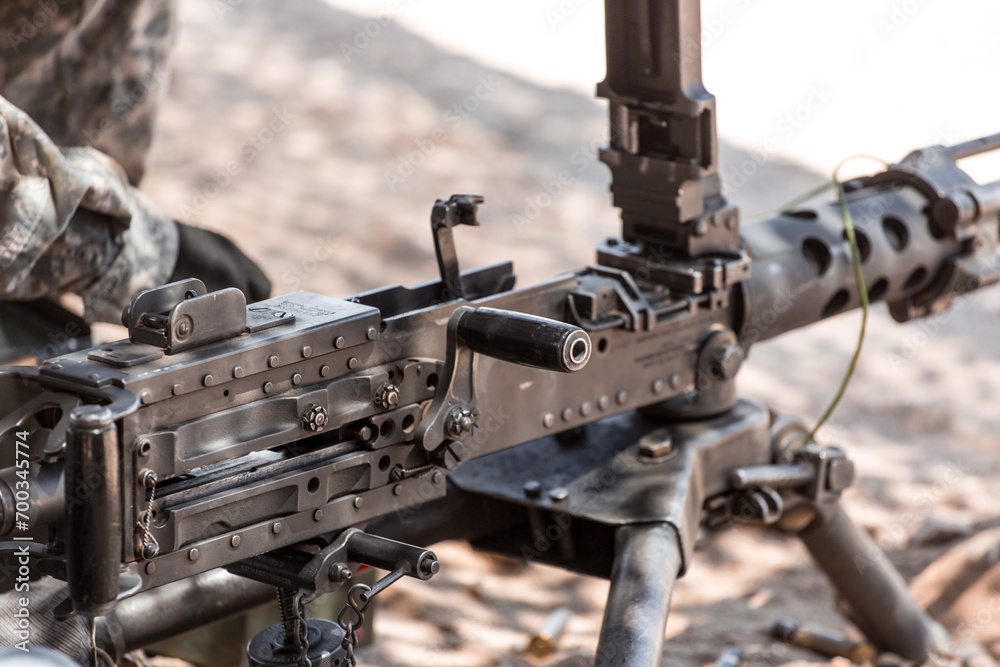 Machine gun mounted on Humvee and person shooting the .50 Caliber ...