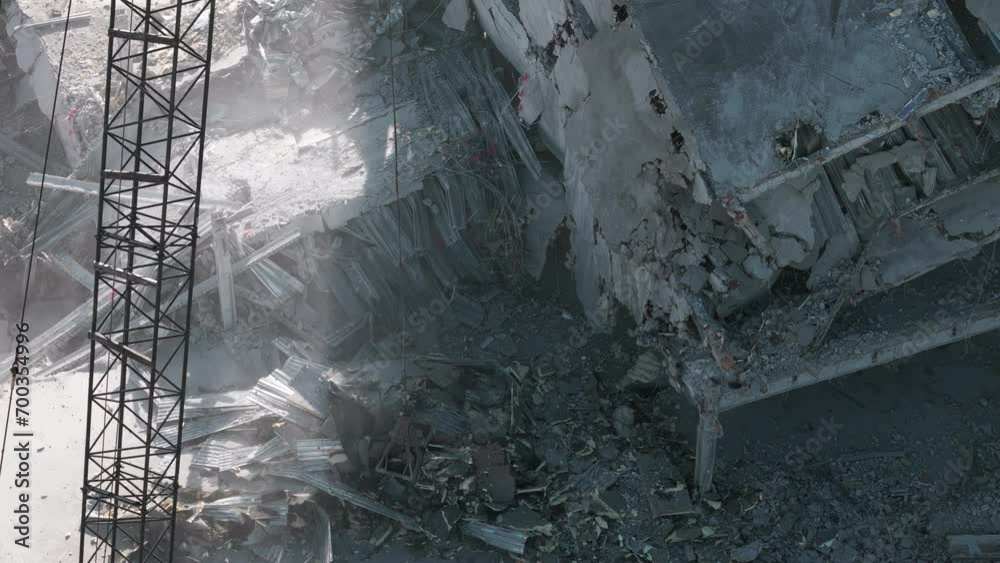 Excavator working rubbish in a demolition site. Top down wide Drone ...