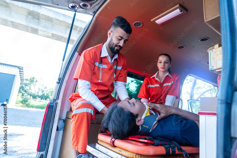 Female rescue workers, nurses and emergency medical personnel save the ...