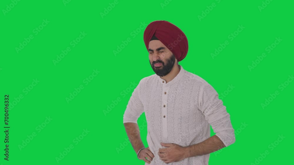Sick Sikh Indian man suffering from stomach pain Green screen Stock ...