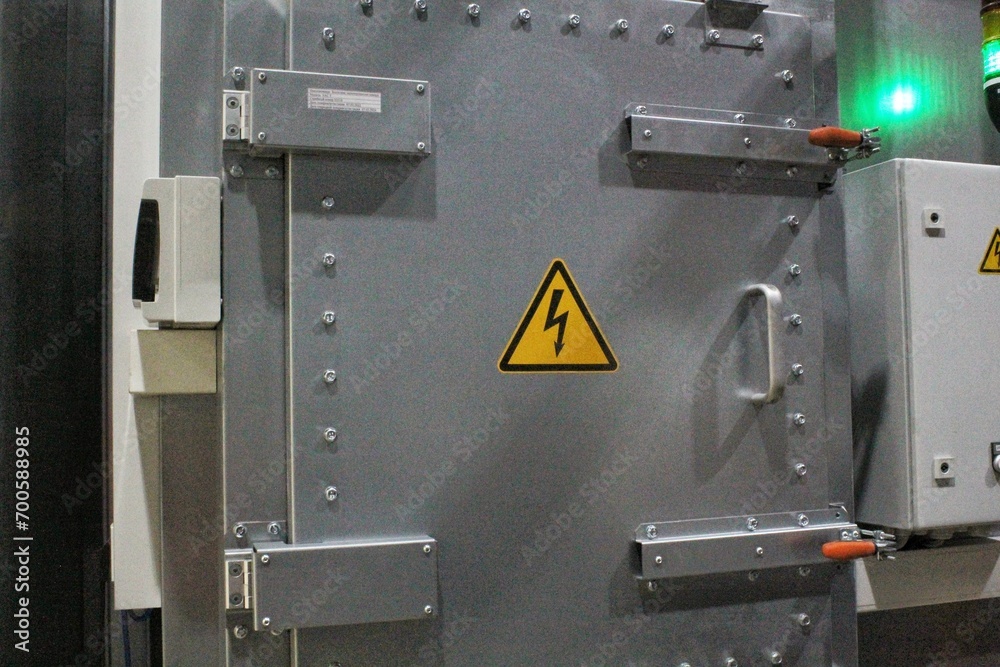 High voltage sign on the wall of a gate power plant. Industrial safety ...