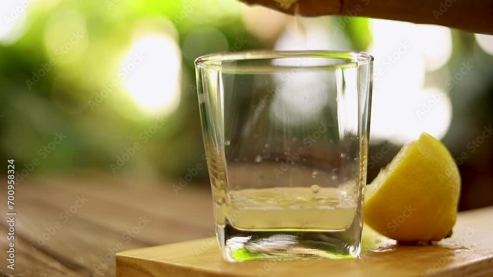 Delicious hand squeezed lemon juice The lemon juice flows from the pulp ...