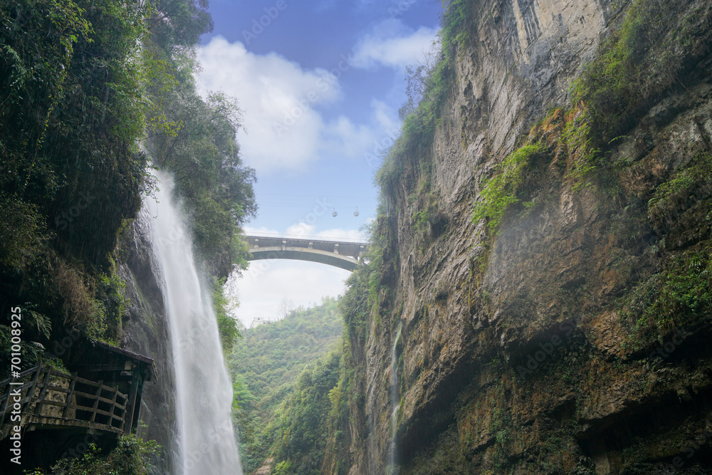 Lush vegetation and waterfalls. Bridges across canyons, cable cars in ...
