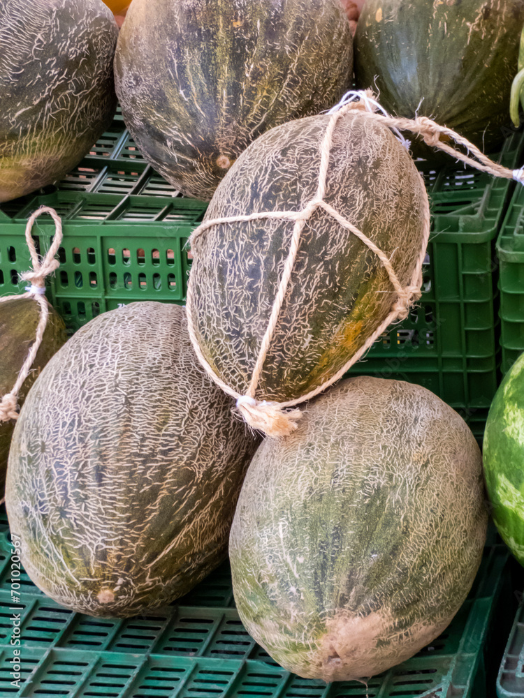 Melons for sale at a street stall, have been grown in local orchards in ...