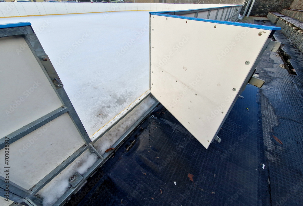 hockey field with goalposts and yellow lines around perimeter. plastic ...