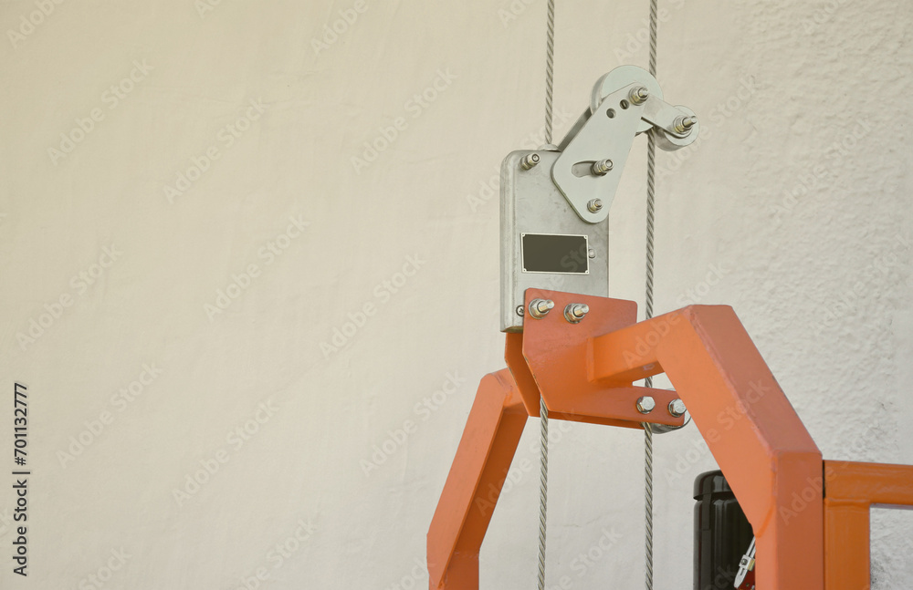 Safety lock as part of suspended wire rope platform for facade works on ...