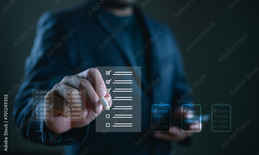 Business performance checklist, businessman using smartphone doing ...