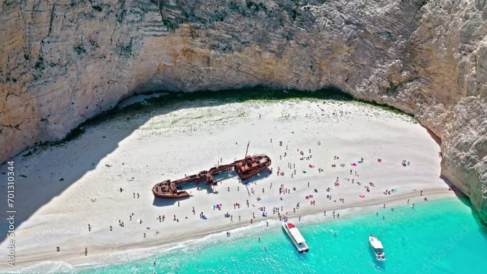 Navagio Pebble Beach between towering cliffs with a shipwreck and ...